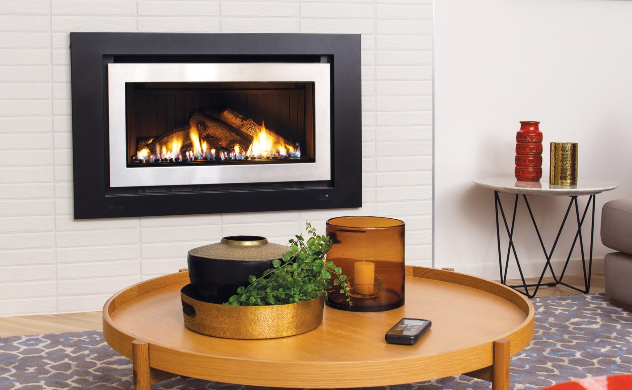 Rinnai 950 Built in Gas Fireplace with Black Trim and Logs